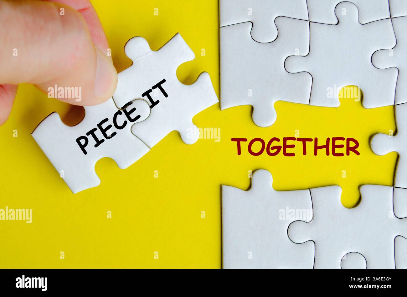 Piece it together text on missing jigsaw puzzle representing teamwork ...