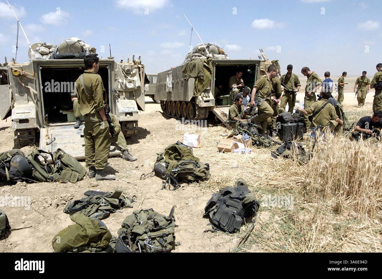 May 12, 2004; Karni Crossing, Israel; Israeli soldiers rest and clean ...