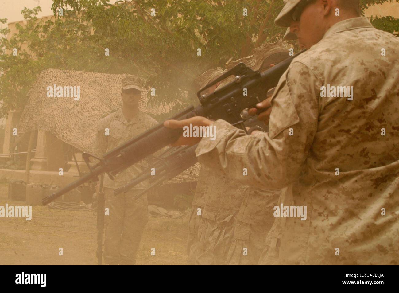 May 15, 2004; Camp Hurricane Point, Iraq; A Marine rifle squad honors ...