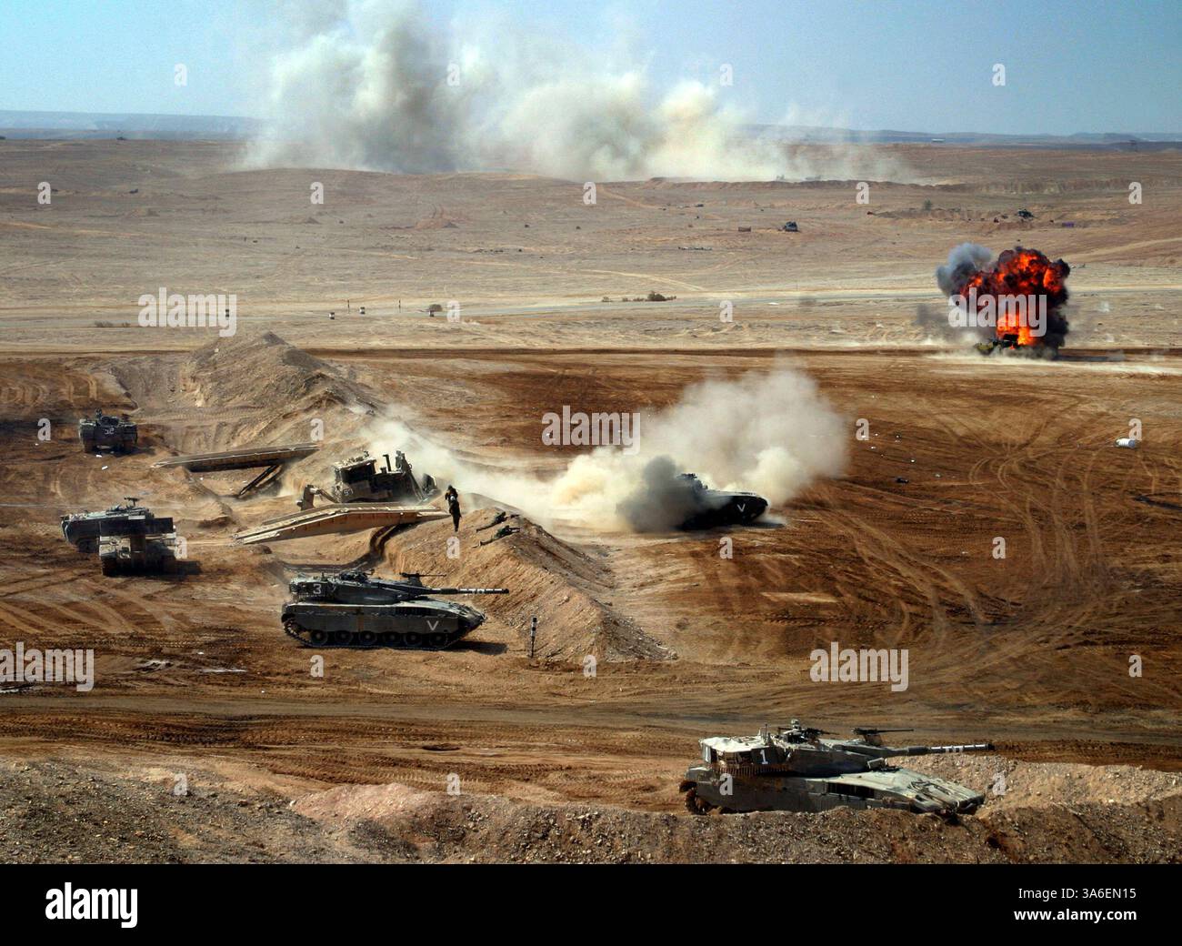 Oct 13, 2004; Negev Desert, ISRAEL; An Israeli tank fires at a nearby ...