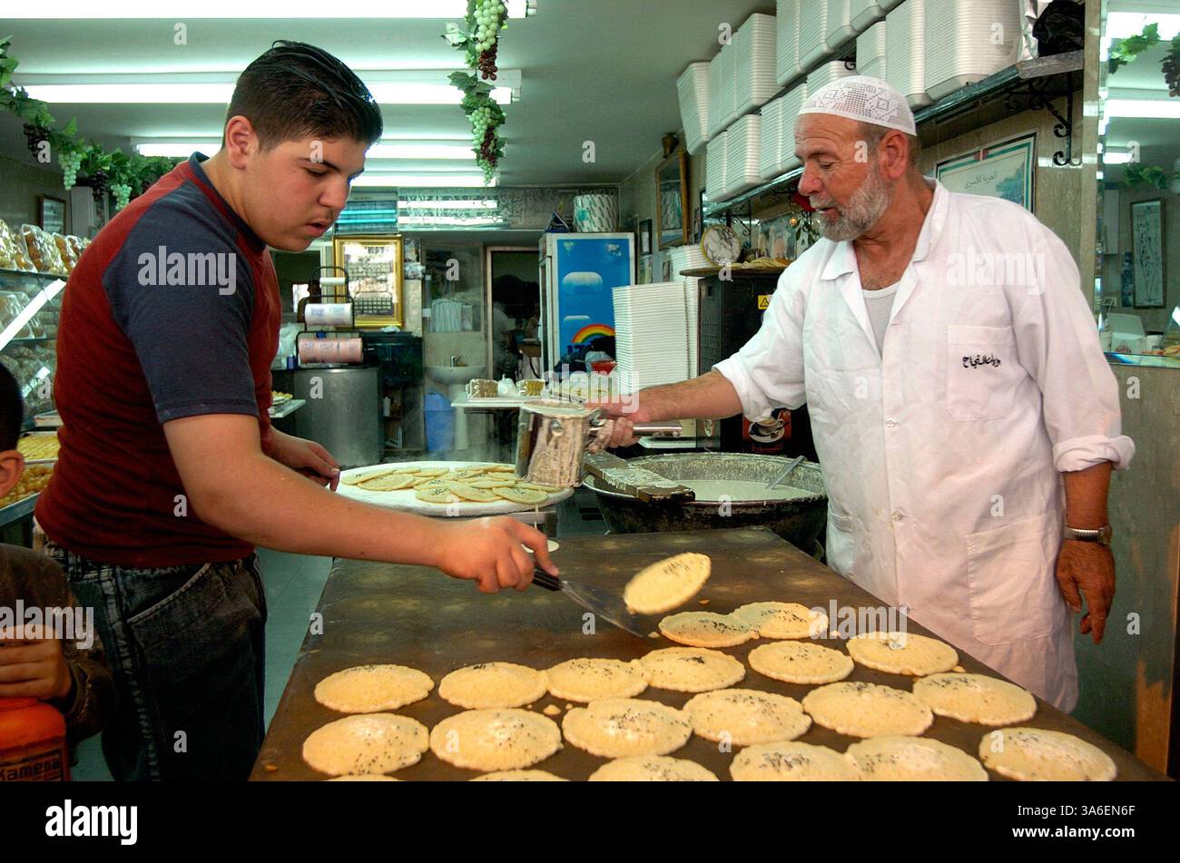 Oct 15, 2004; Jerusalem, ISRAEL; A Palestinian baker makes the ...