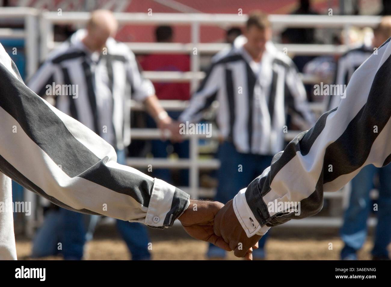Oct 17, 2004; Angola, LA, USA; Inmate rodeo contestants form a prayer ...