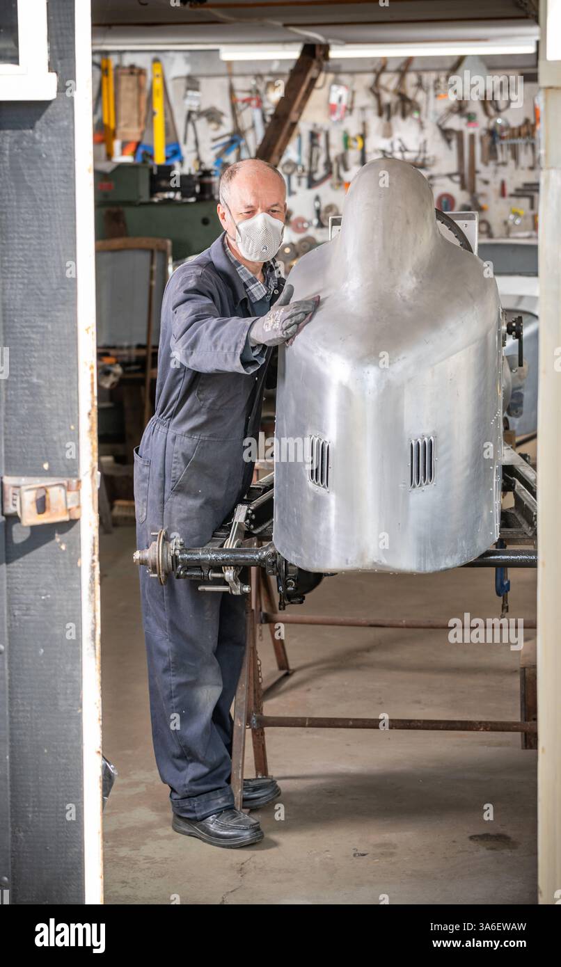 Alan Morris works on making the body for an Austin Seven single seater ...