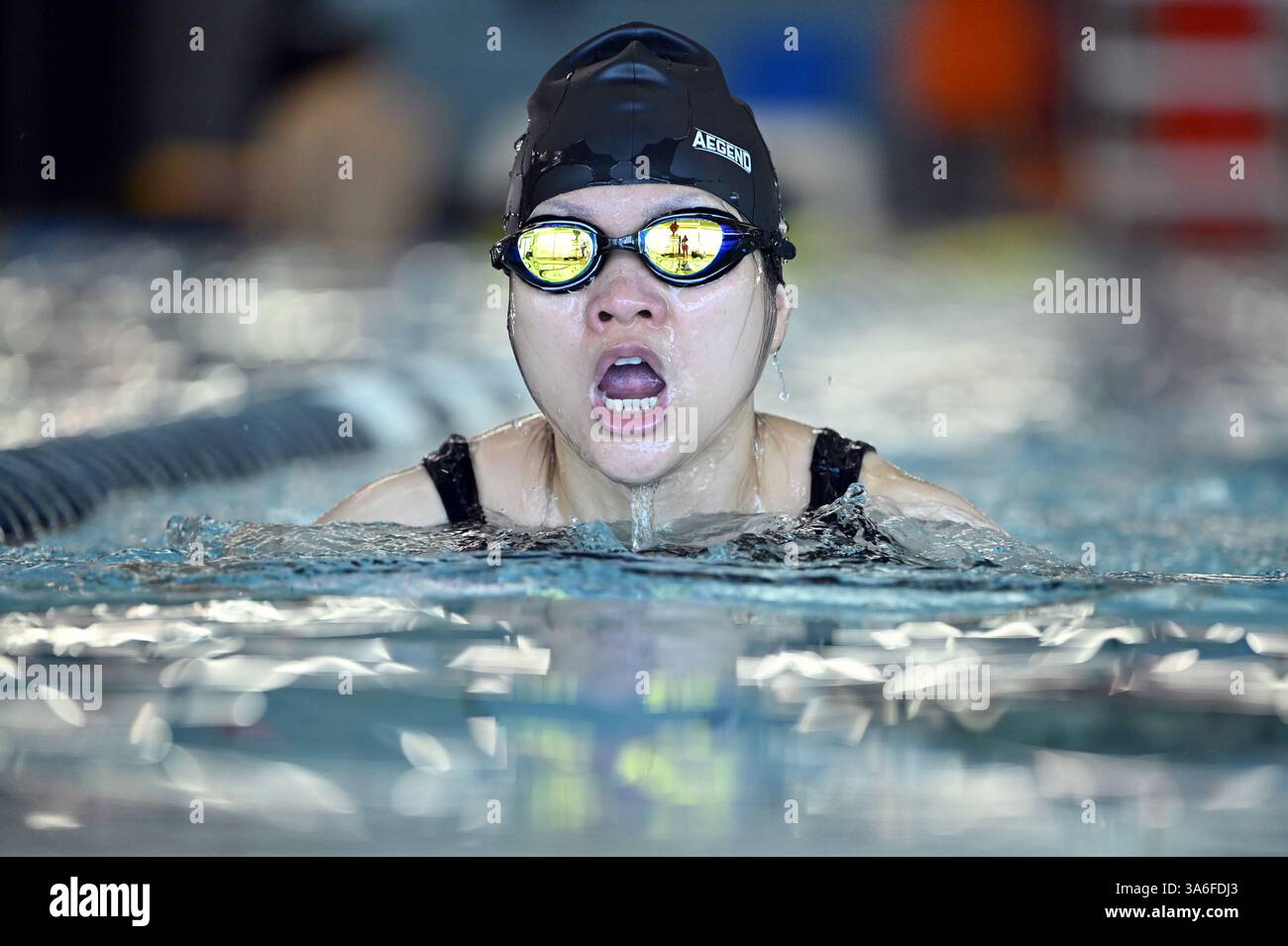New York, USA. 25th Mar, 2025. A woman is seen swimming during a press ...