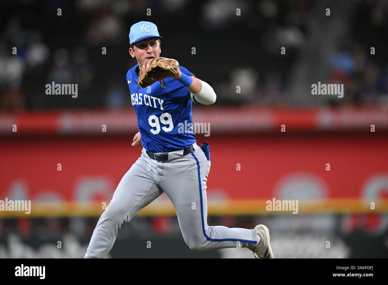 Kansas City Royals short stop Cam Devanney advances towards the ball in ...