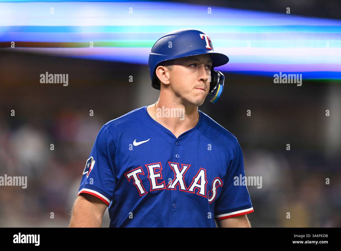 Texas Rangers' Wyatt Langford walks to the dugout in an exhibition ...