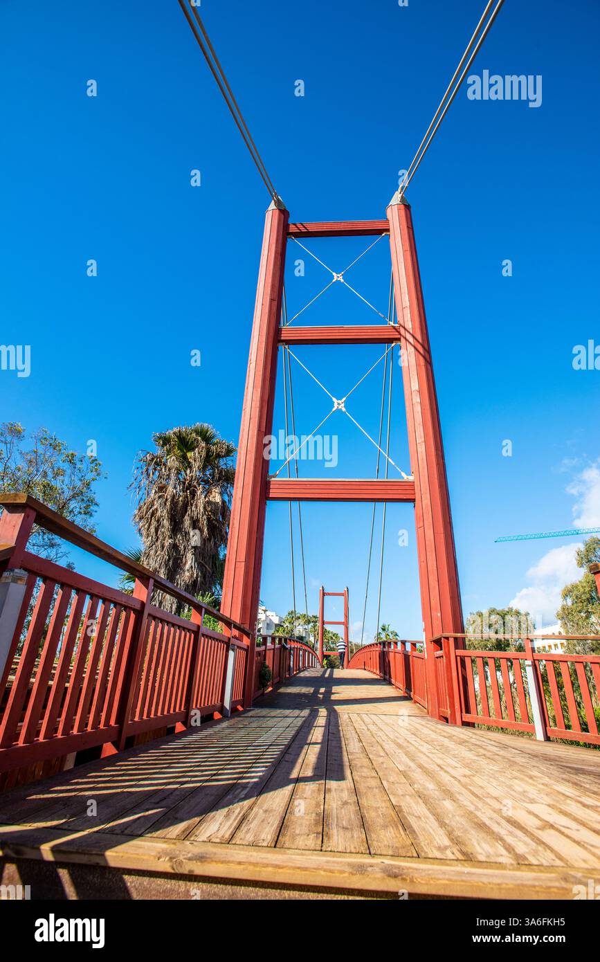 The footbridge crosses the Verde River and connects the seafront ...