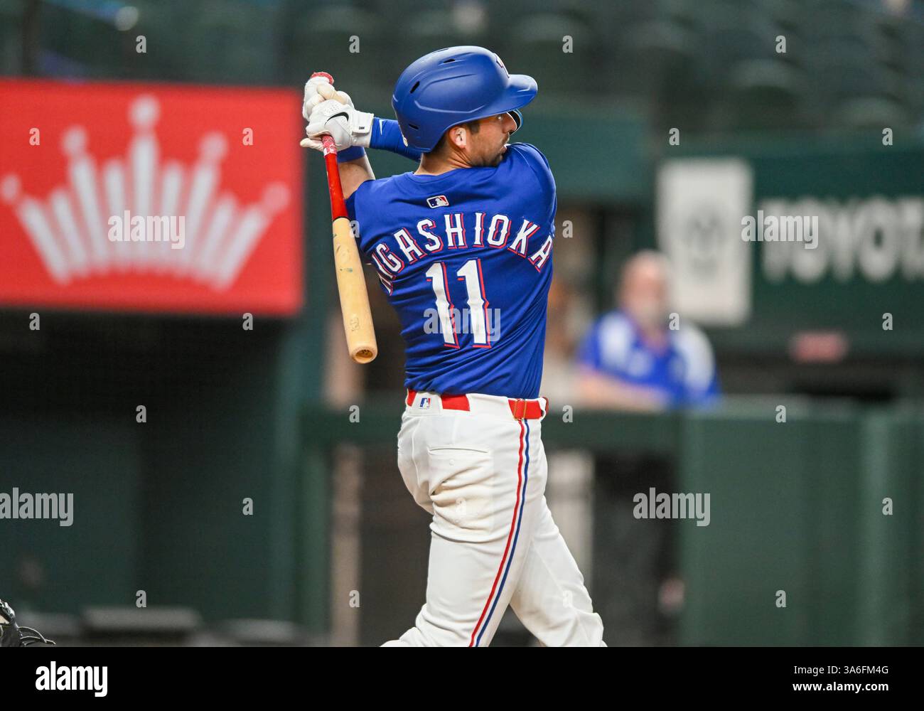 Texas Rangers' Kyle Higashioka swings through a pitch in an exhibition ...