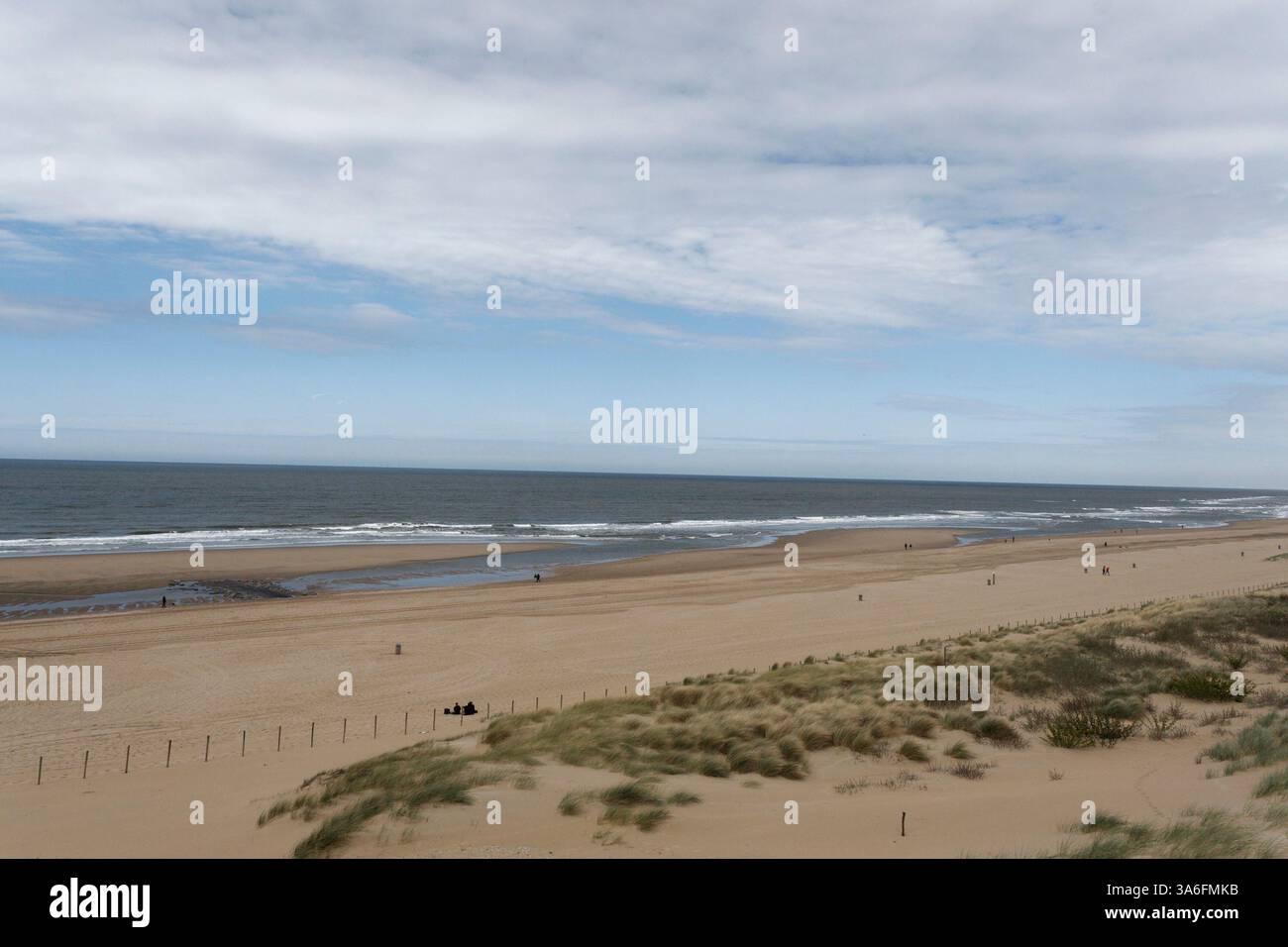 Overview over the sand dunes with grass and the shoreline of the North ...