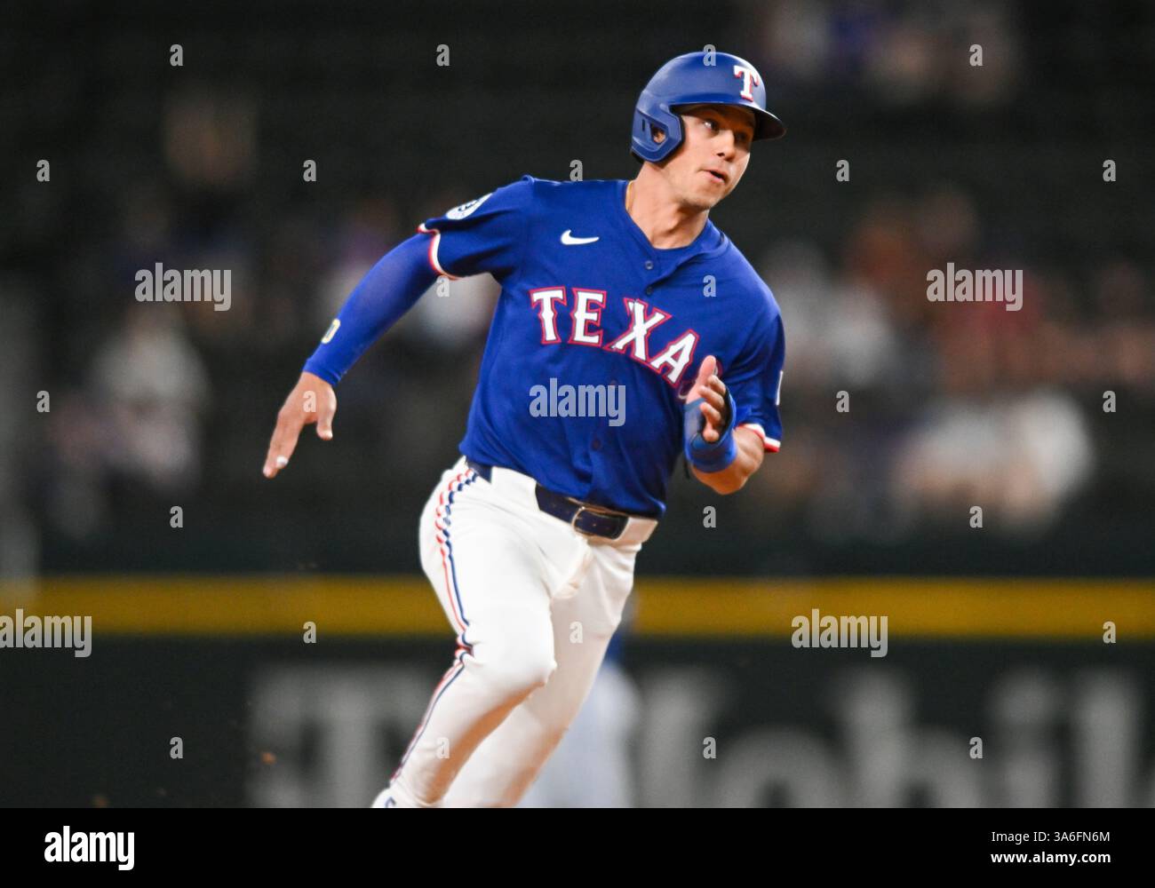 Texas Rangers' Sam Haggerty rounds second base in an exhibition ...