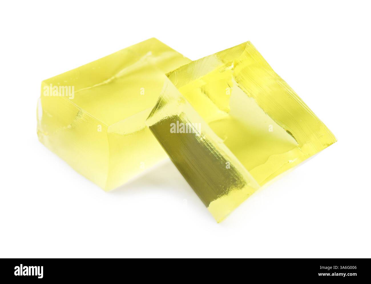 Tasty yellow jelly cubes isolated on white Stock Photo - Alamy