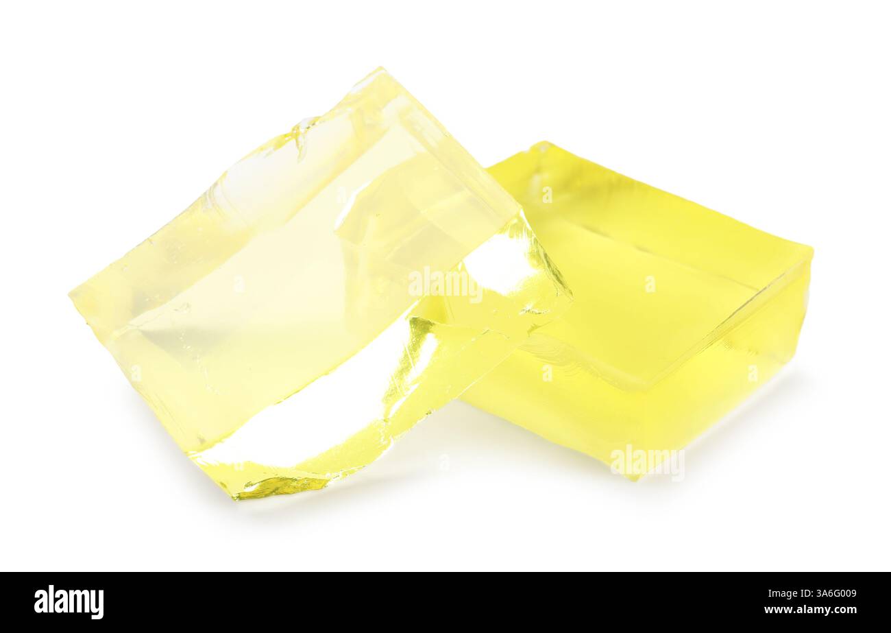 Tasty yellow jelly cubes isolated on white Stock Photo - Alamy