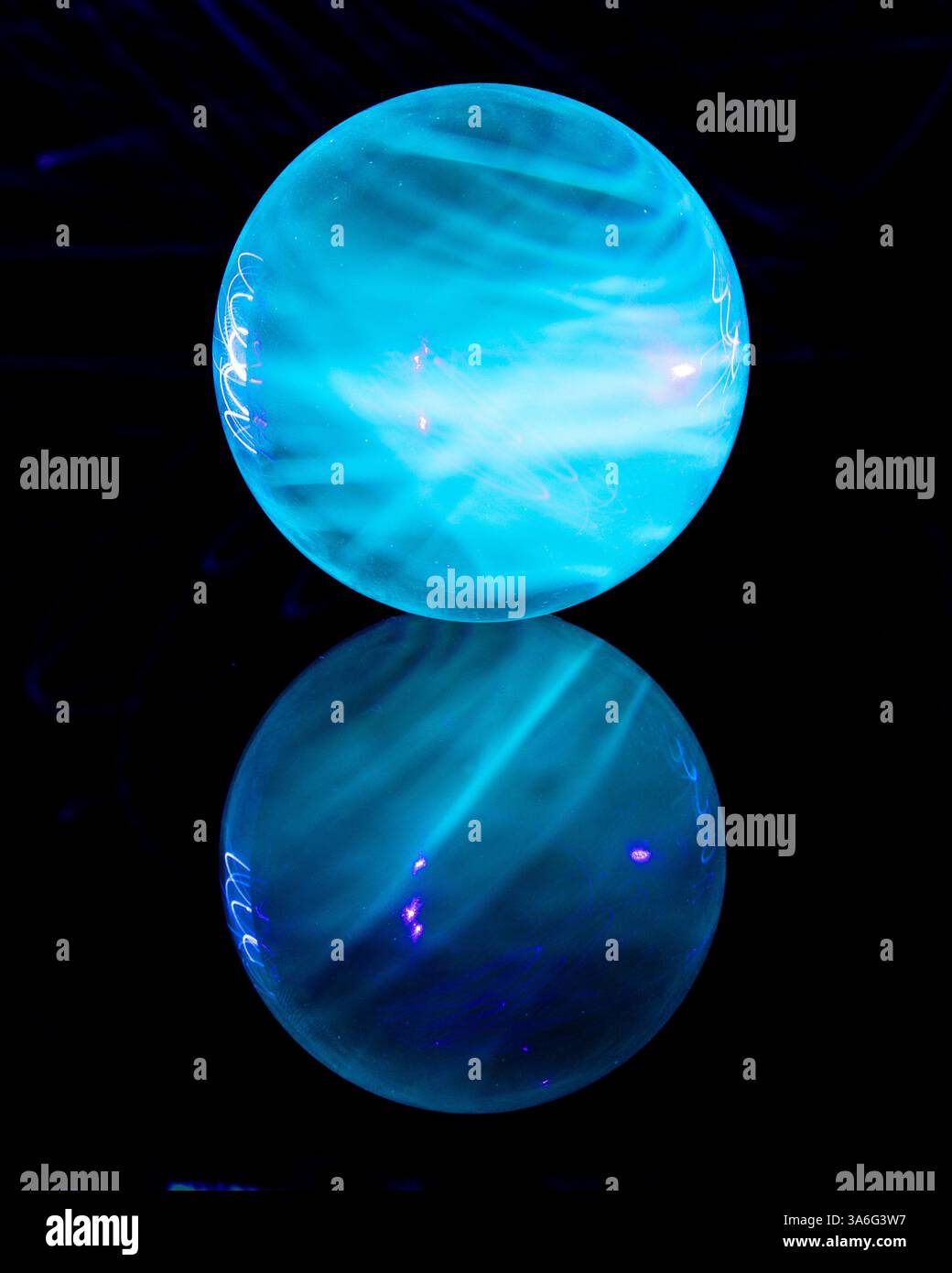 Glowing Glass Orb with Laser Lights Running Through It Stock Photo - Alamy