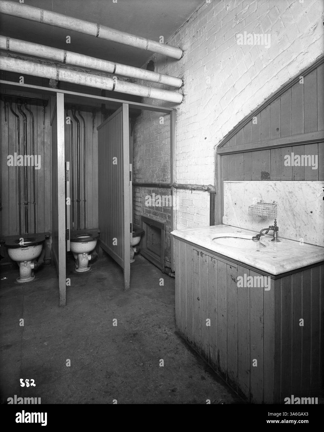 The photo shows the girls' restroom at Webster School, featuring boxed ...