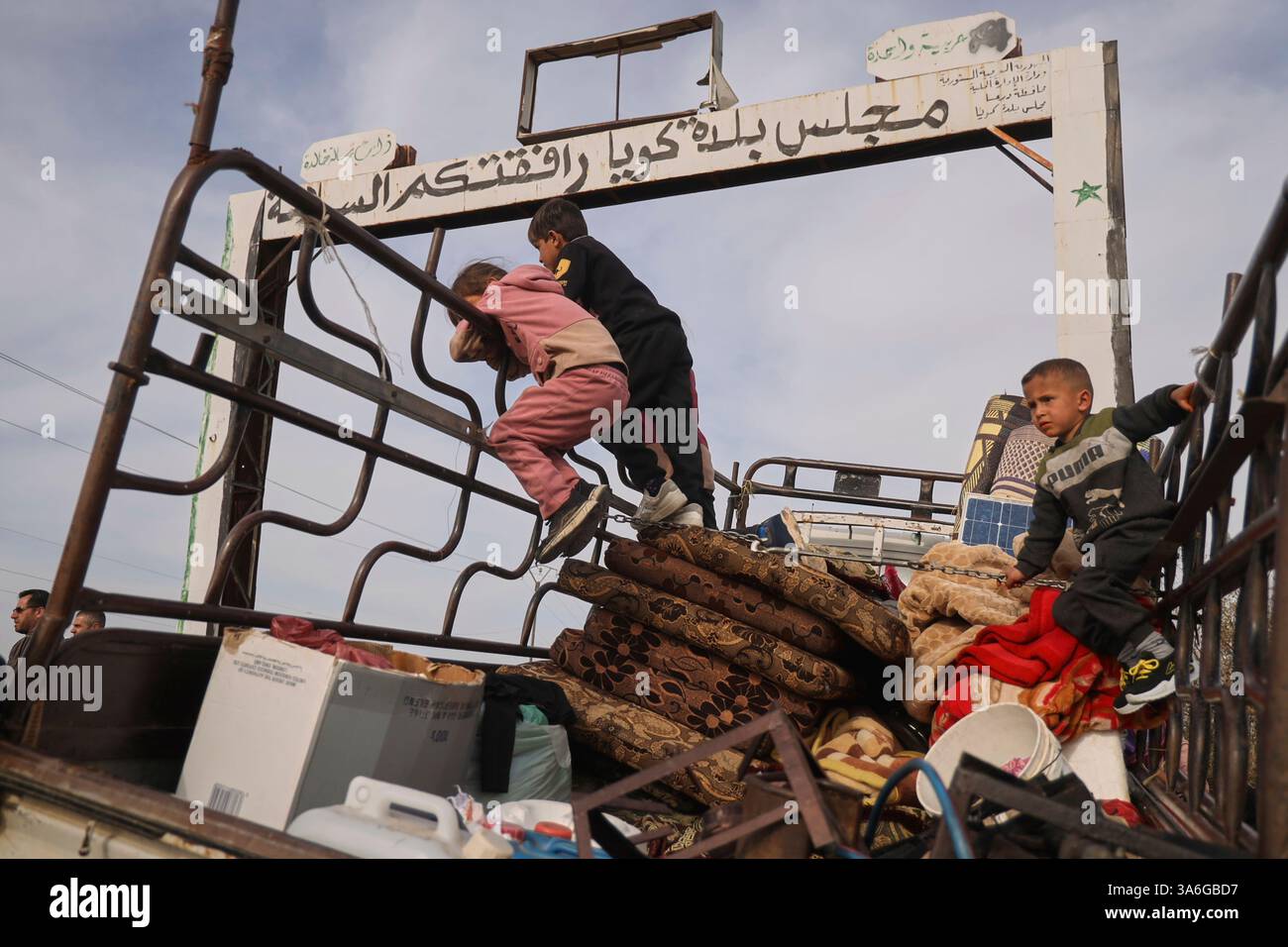 Children ride in a truck as they are evacuated due to fears of Israeli ...