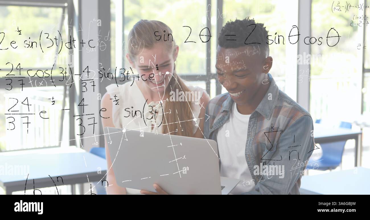 In school, students collaborating on laptop solving complex math ...