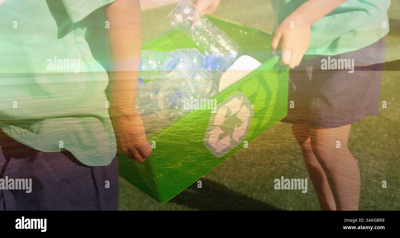 Collecting plastic bottles, children placing them in green recycling ...