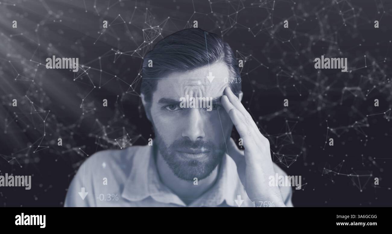 Businessman concentrating with hand on forehead, analyzing digital data ...