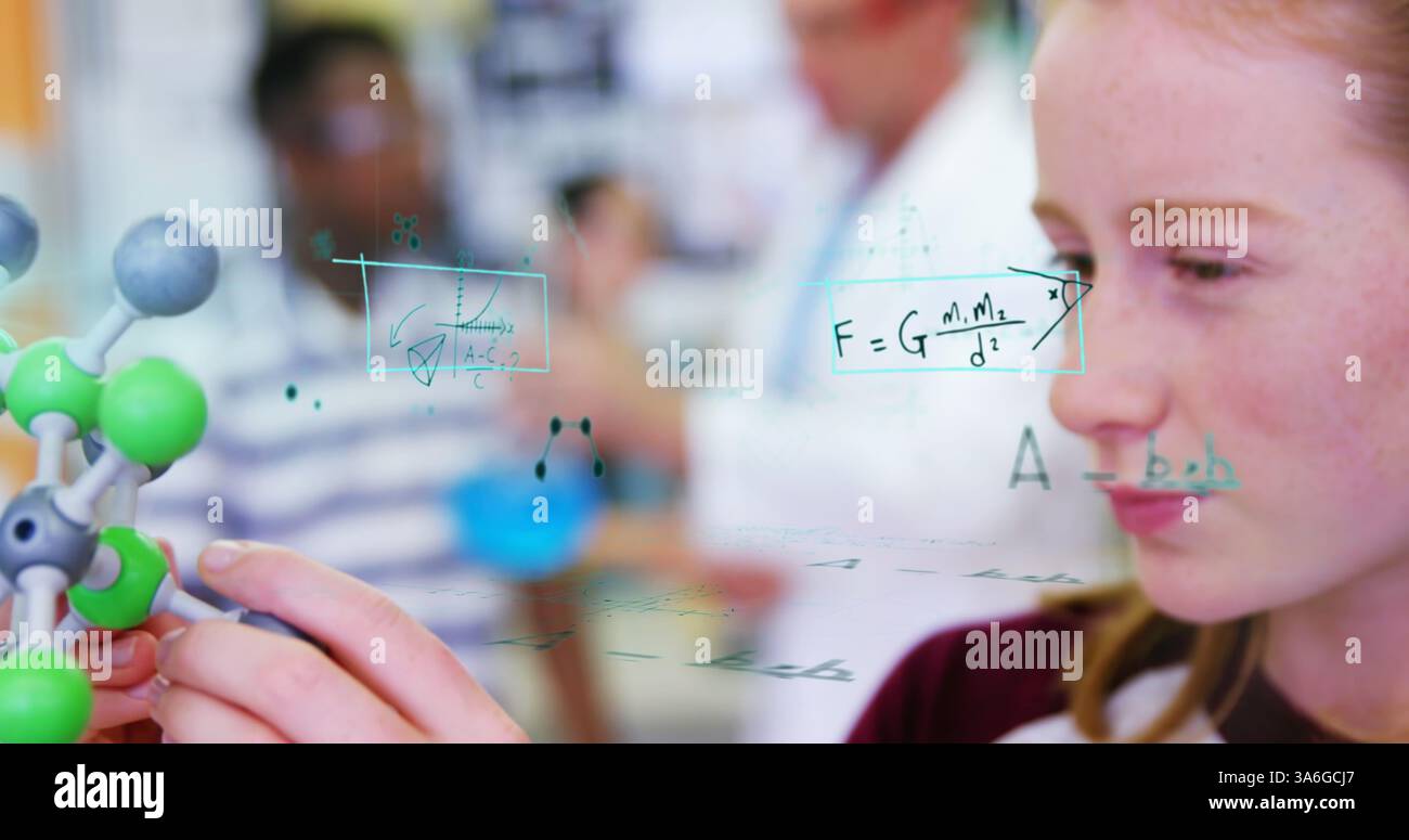 Student examining molecular model in science class, focusing on ...