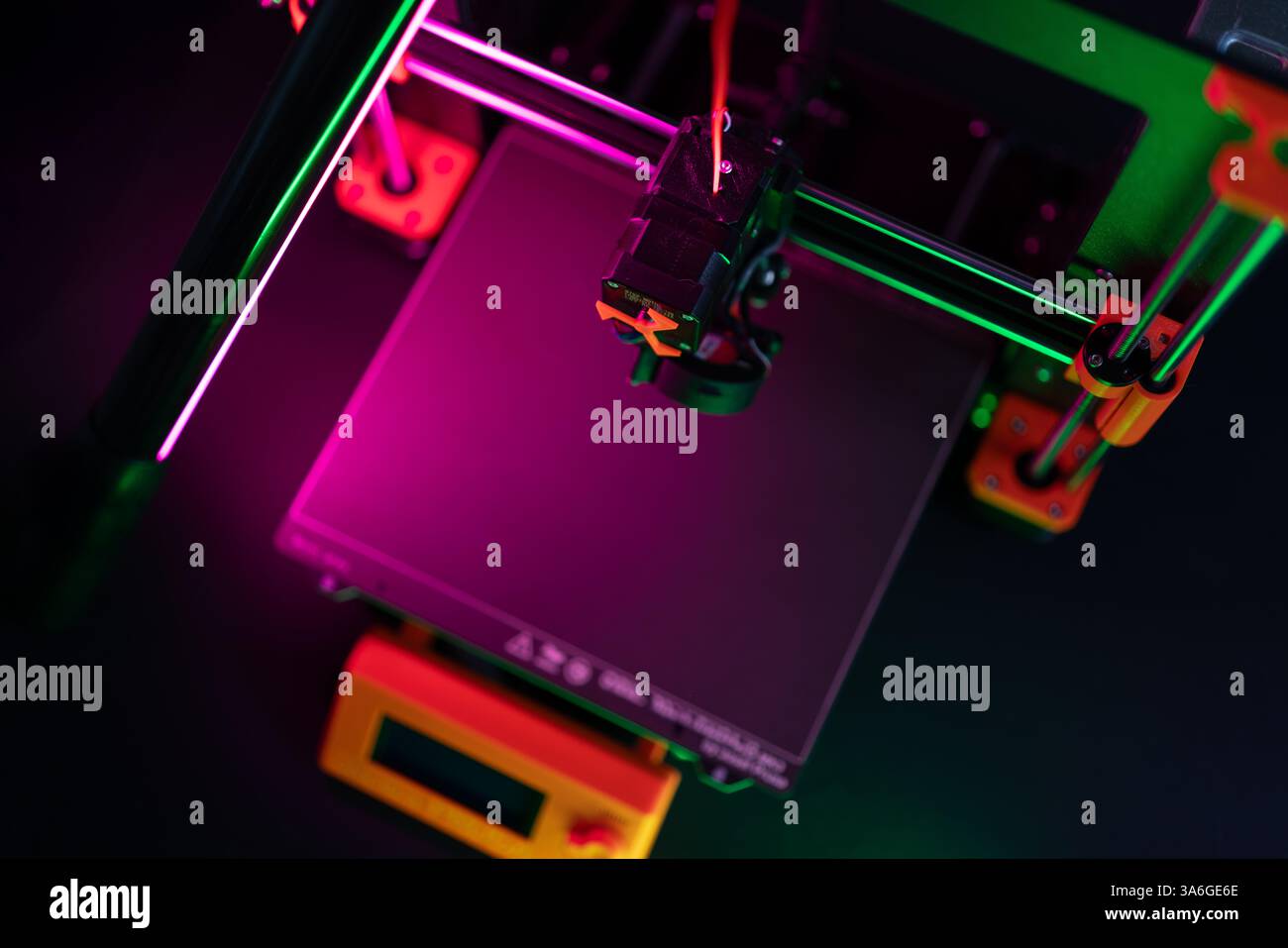 3d printer from above neon light dark background Stock Photo - Alamy