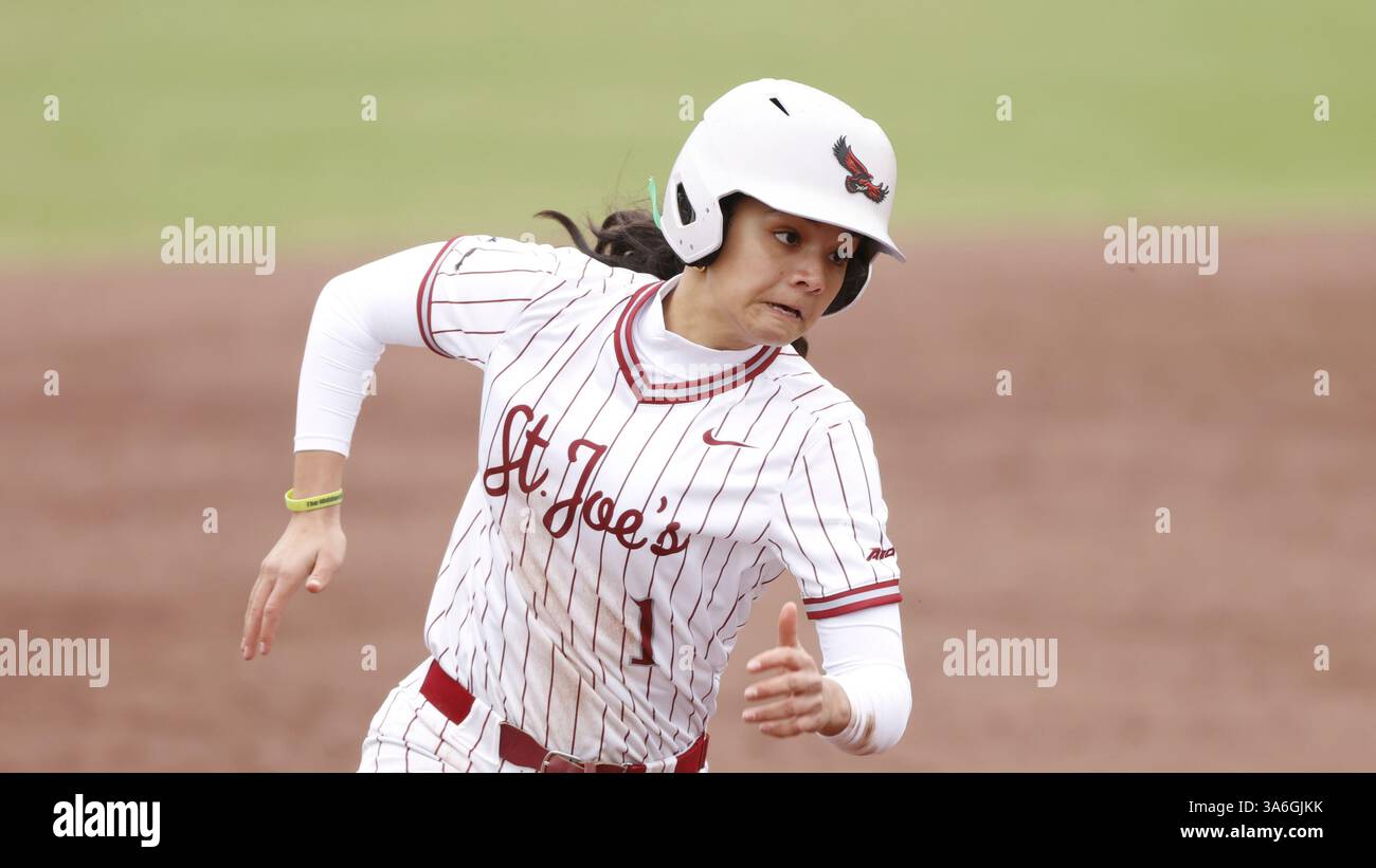St. Joe's baserunner Jayda Shehadi rounds second base while facing ...