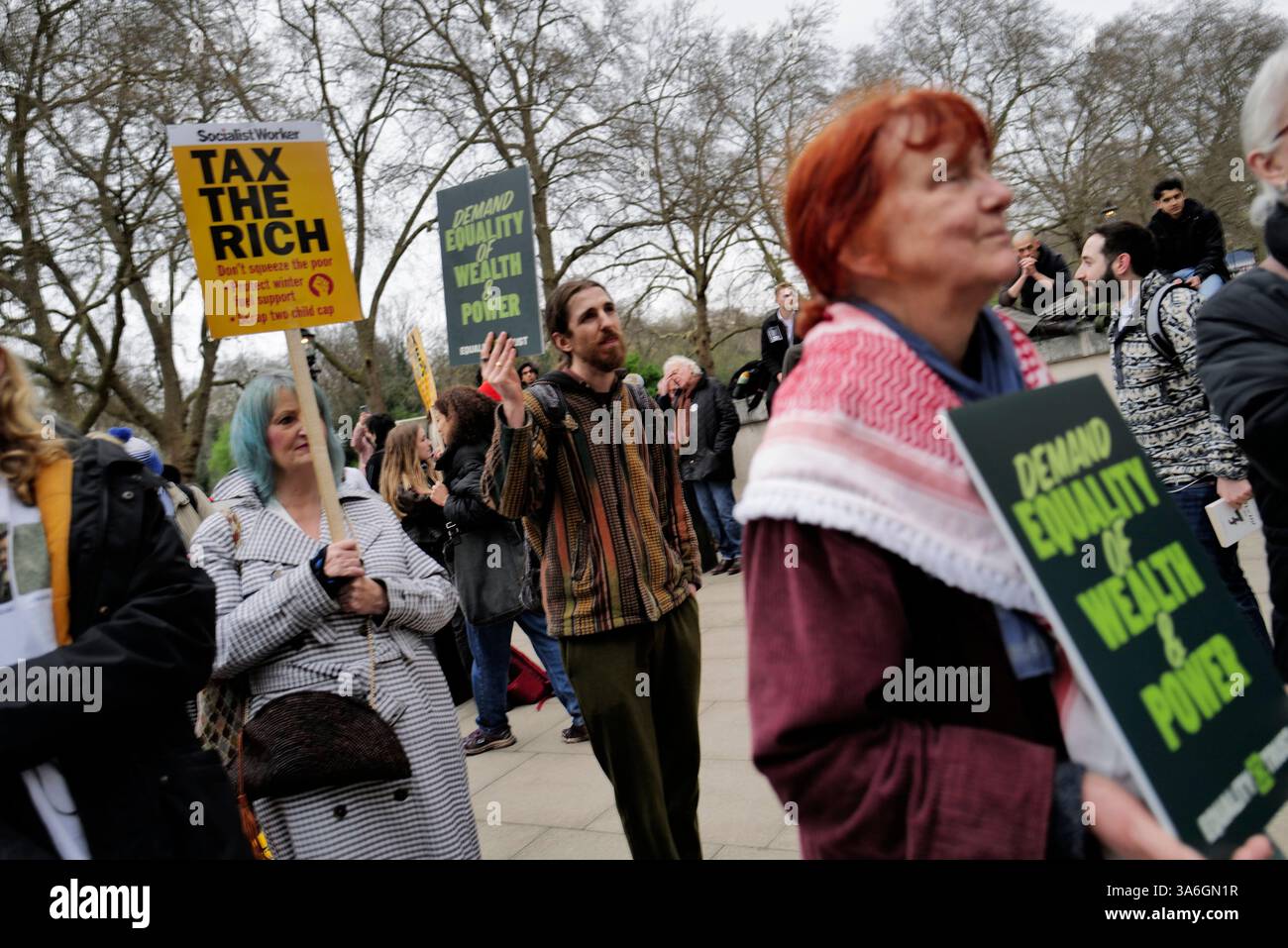 Protesters gather outside the UK Treasury in London for the “Tax the ...