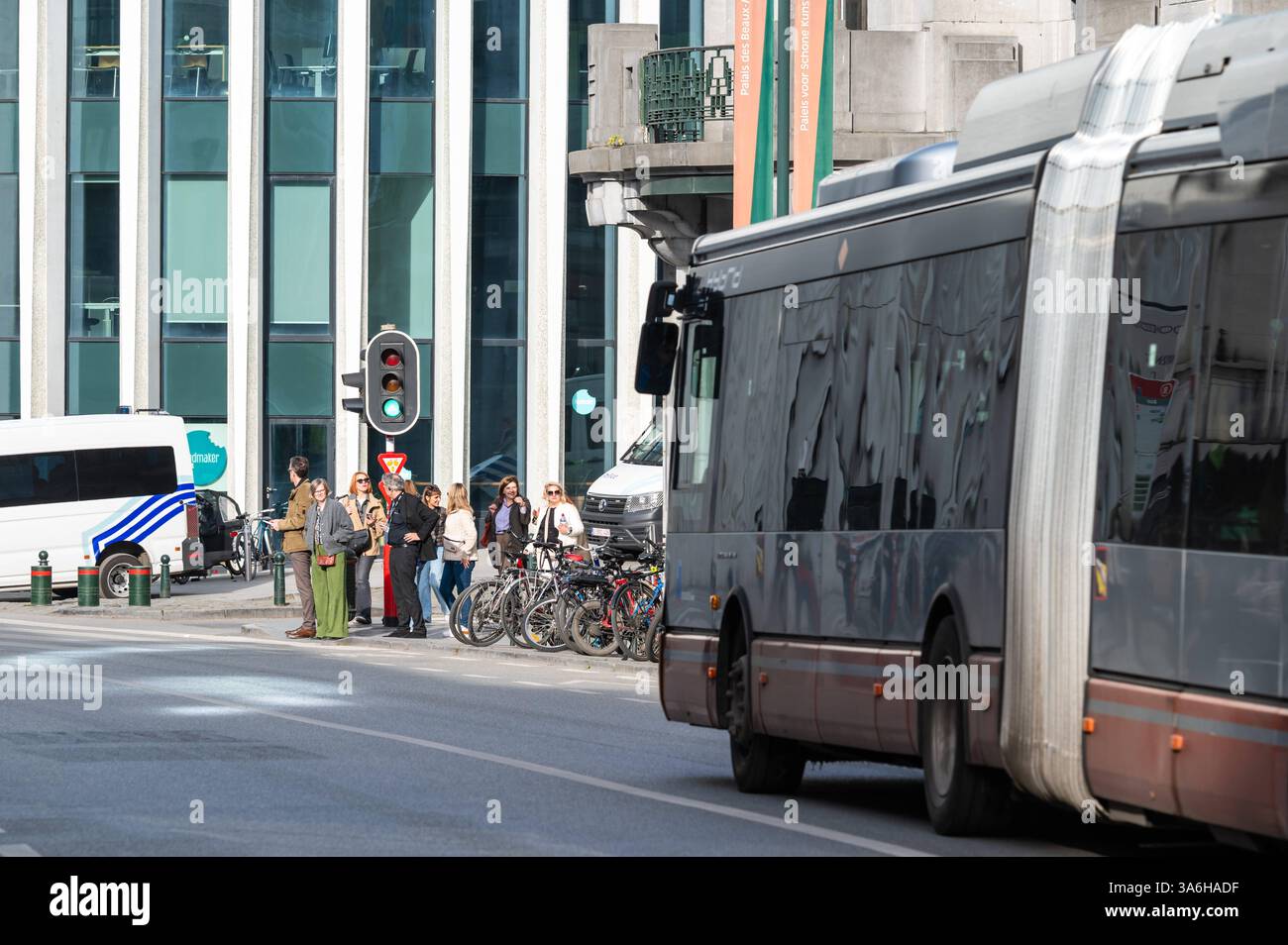 STIB MIVB bus driving down the Rue Ravenstein in Brussels city center ...
