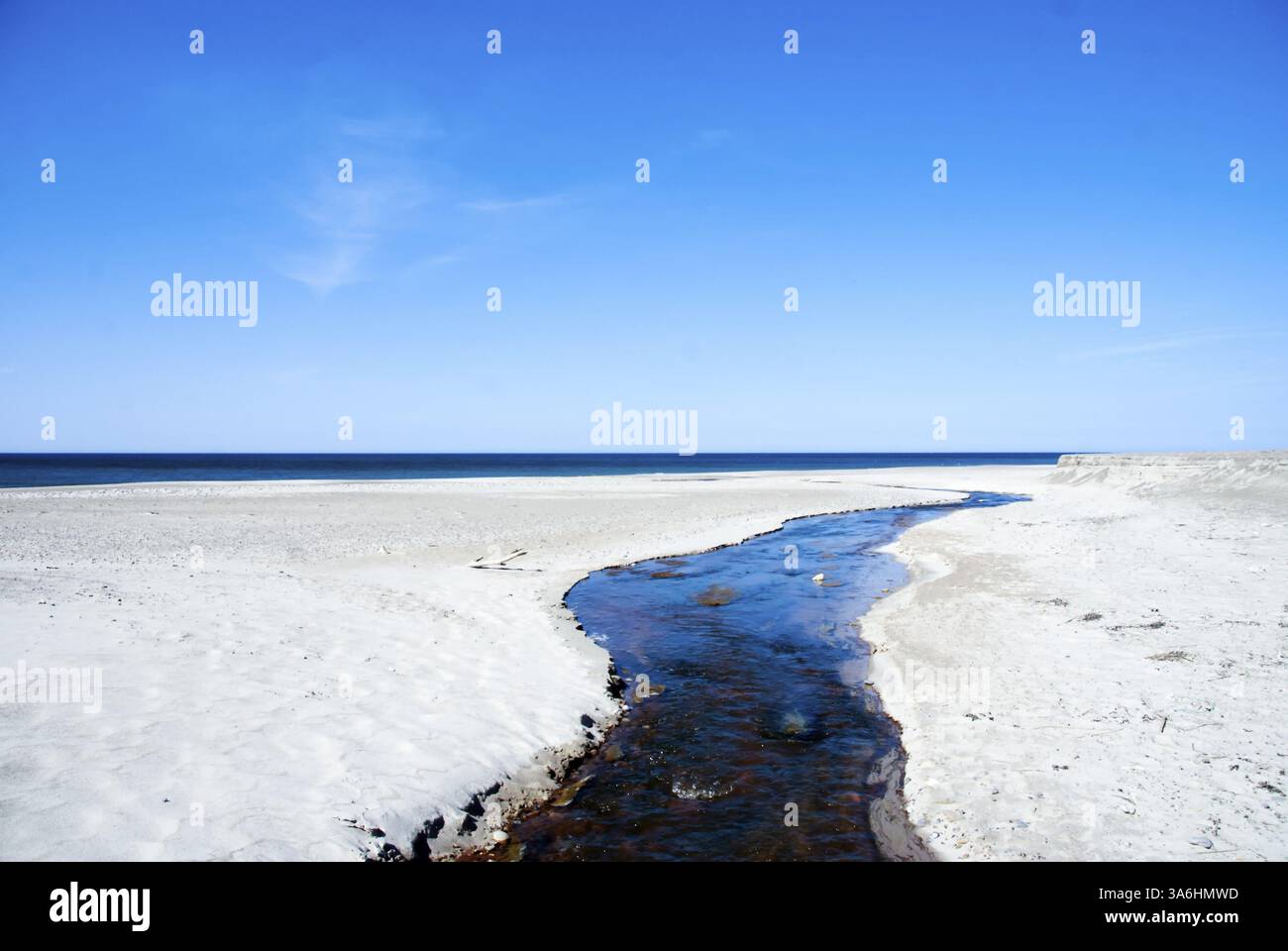 Stream flows into the sea Stock Photo - Alamy