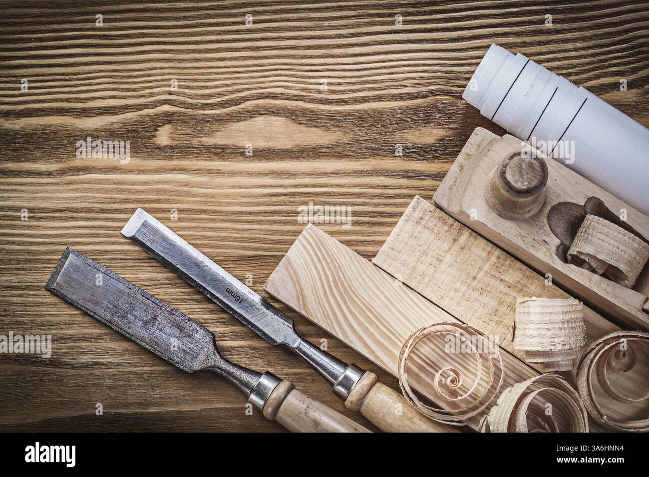 Engineering drawing planer chisels wooden bricks shavings on wood board ...