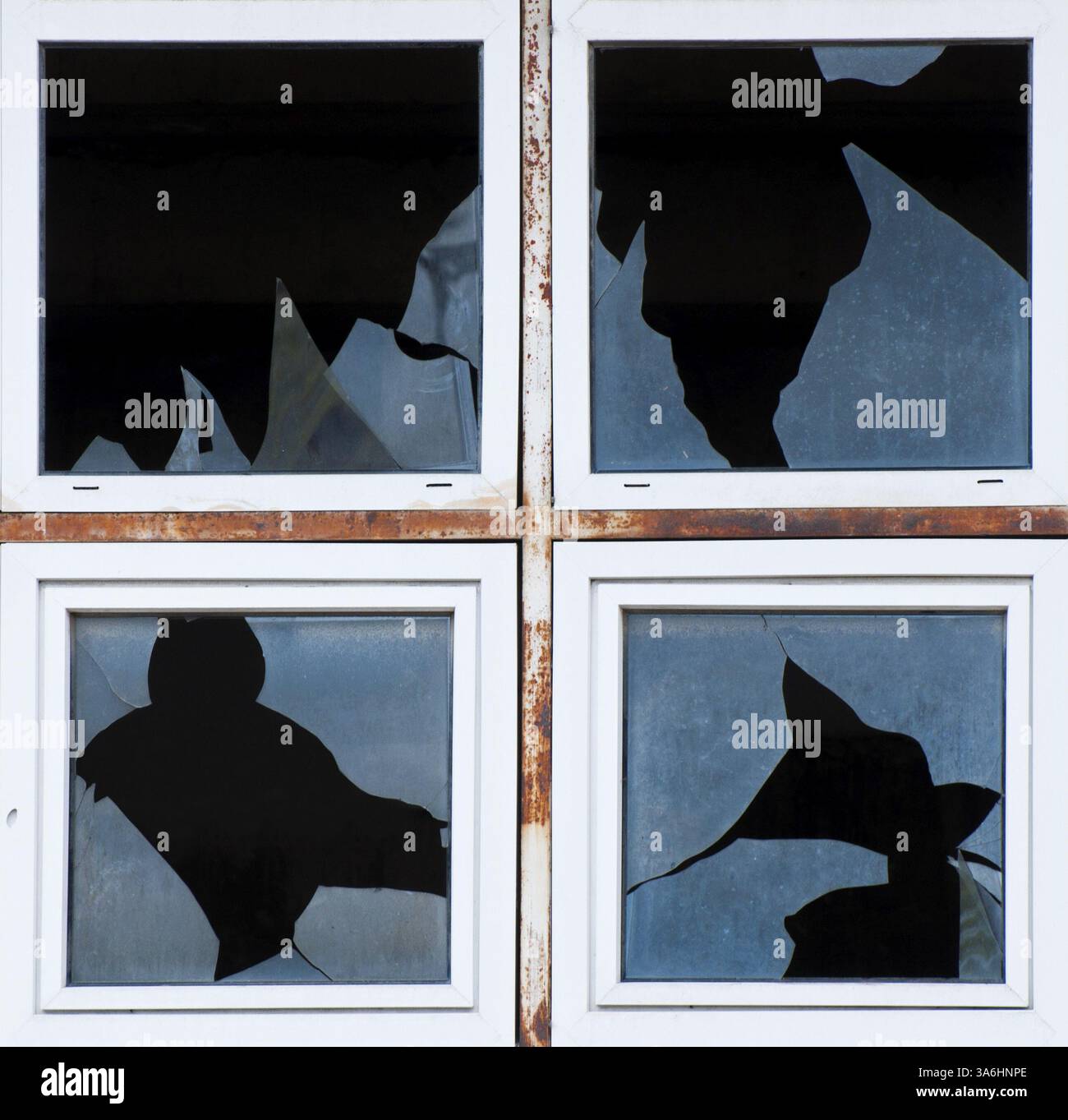 Broken windows of old building. White frames Stock Photo - Alamy