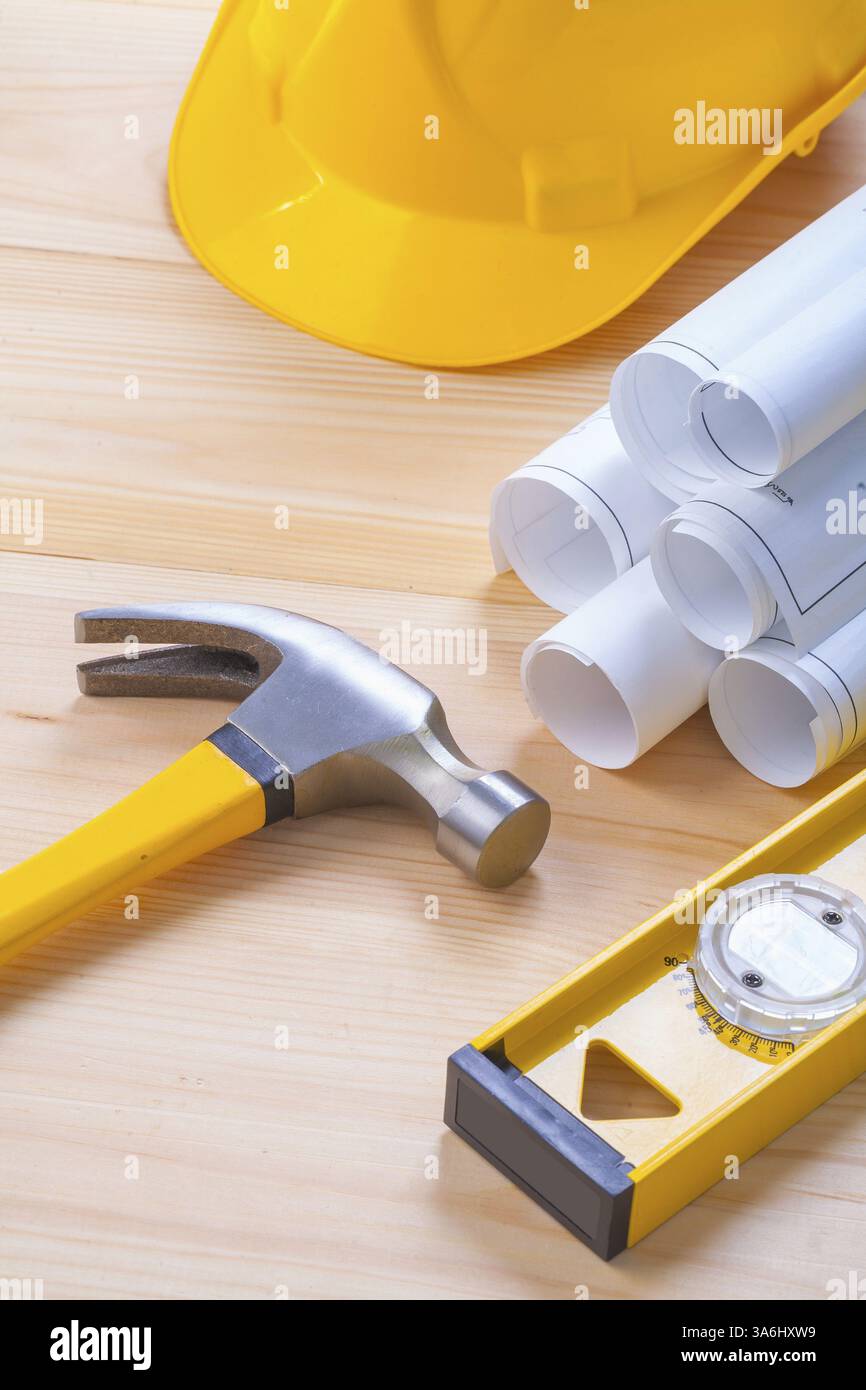 Composition of construction tools hammer level helmet blueprints on ...