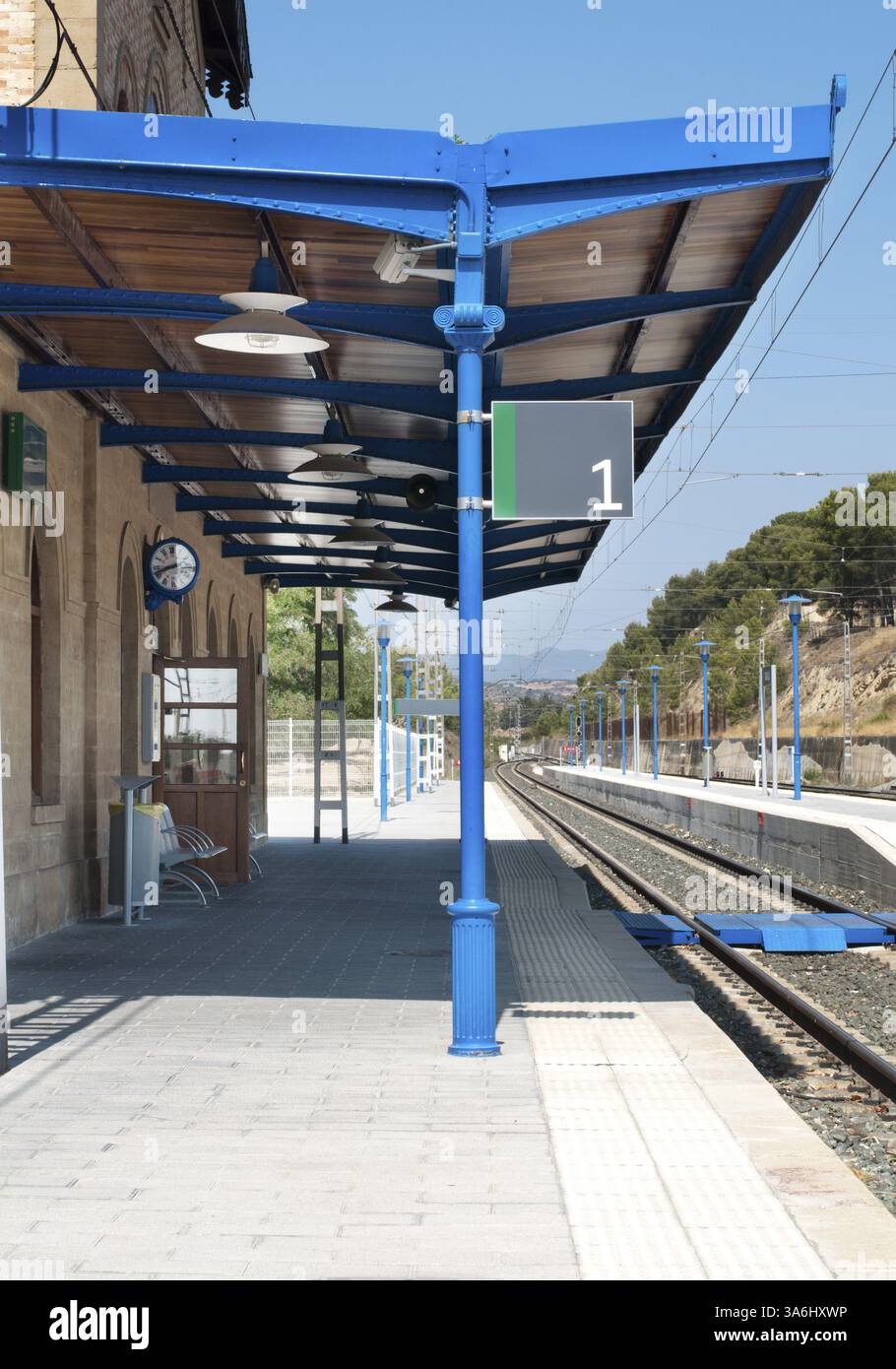 Ancient-style railway station and railroad rails Stock Photo - Alamy