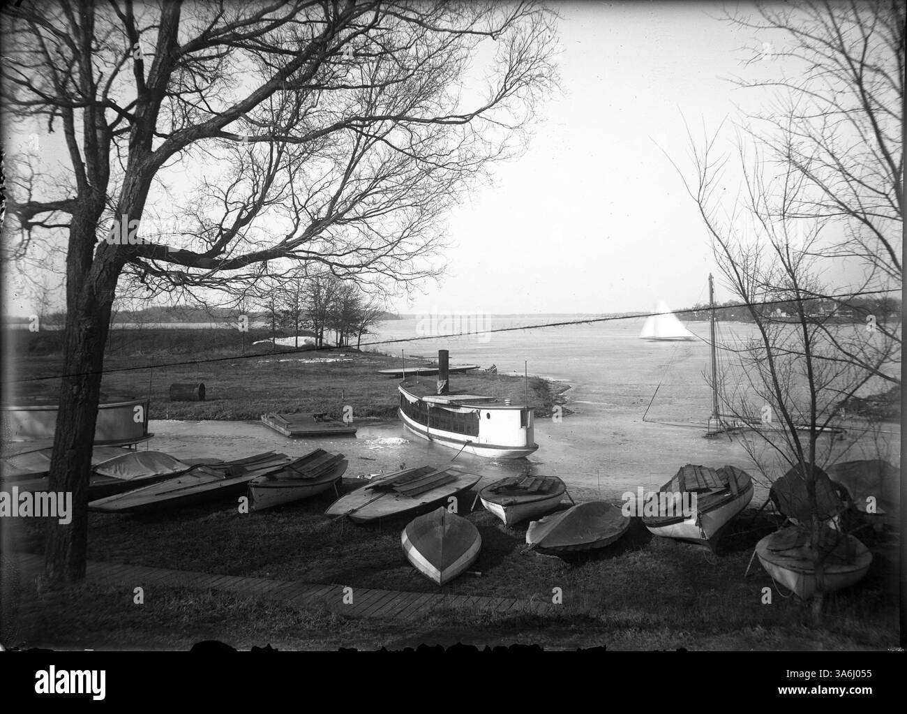 Boats are seen on the ice at Excelsior on Lake Minnetonka, showcasing ...