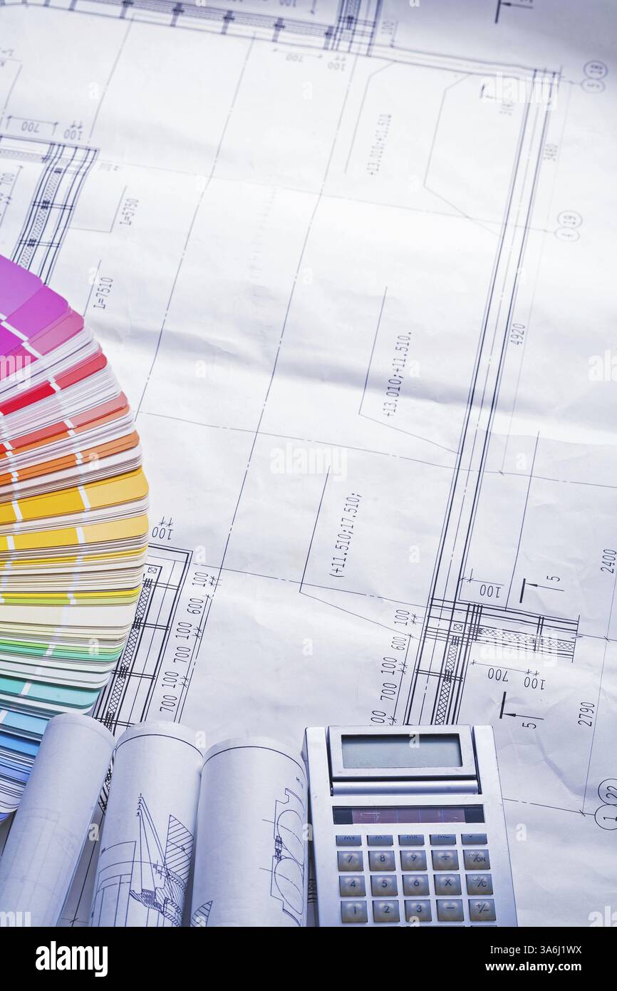 Rolled up white blueprints color palette calculator compsotion Stock ...