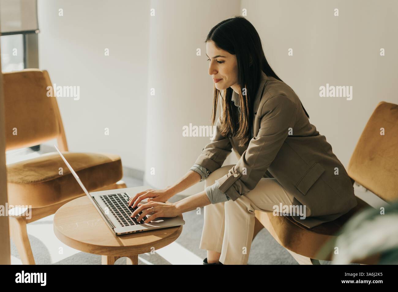 Professional woman intently typing hi-res stock photography and images ...