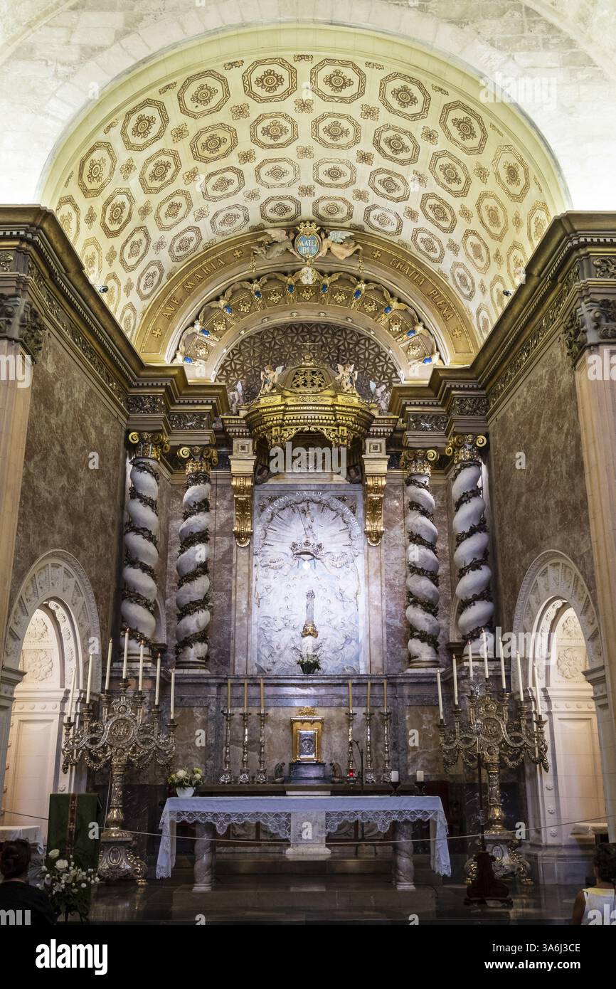 Gothic altarpiece and colorful paintings of religious imagery ...