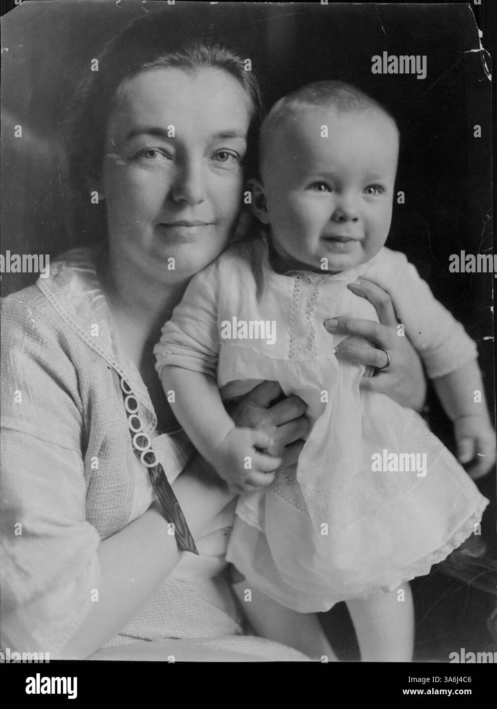 Mrs. J. A. O. Preus is pictured with her son, a notable image ...