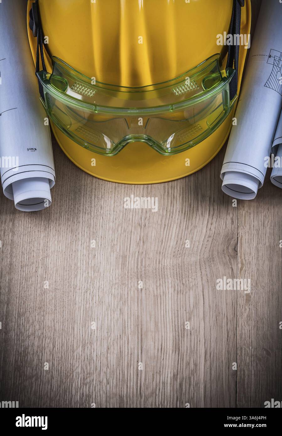 Goggles rolled up blueprints and hard hat construction concept Stock ...