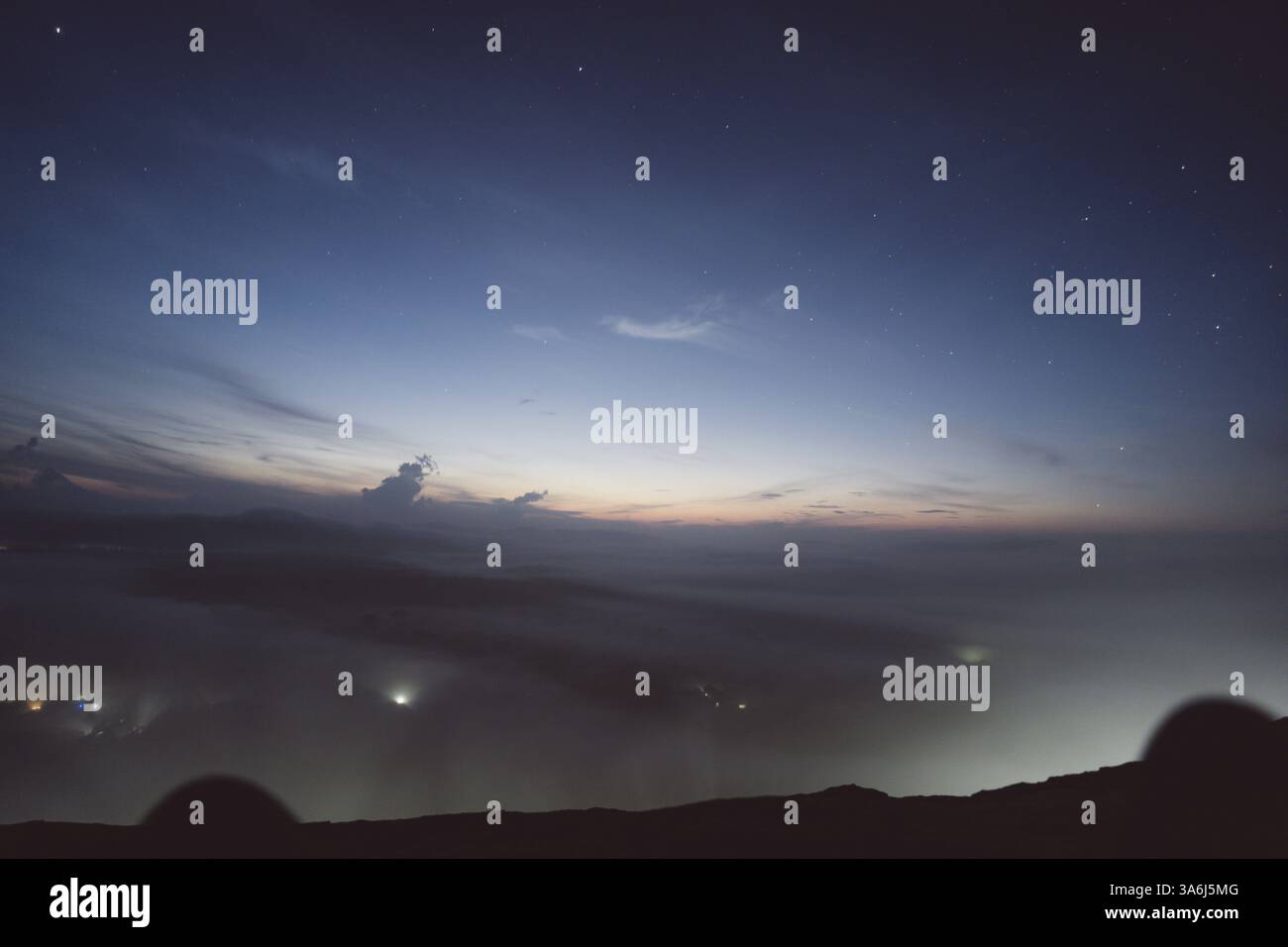 Starry night landscape with shimmering sky and soft reflections of ...