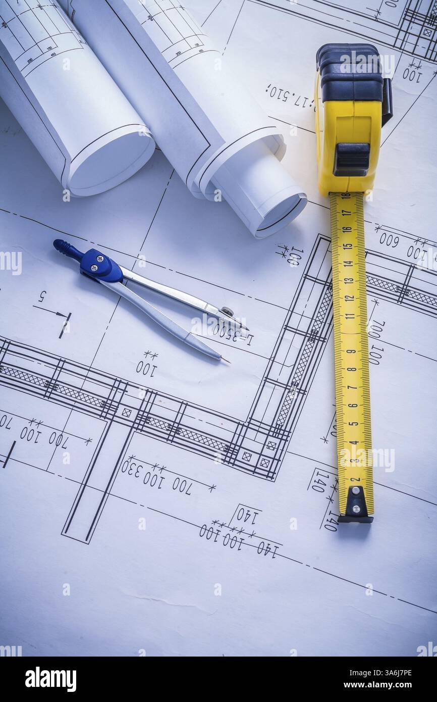 Compass tapeline blueprints Stock Photo - Alamy