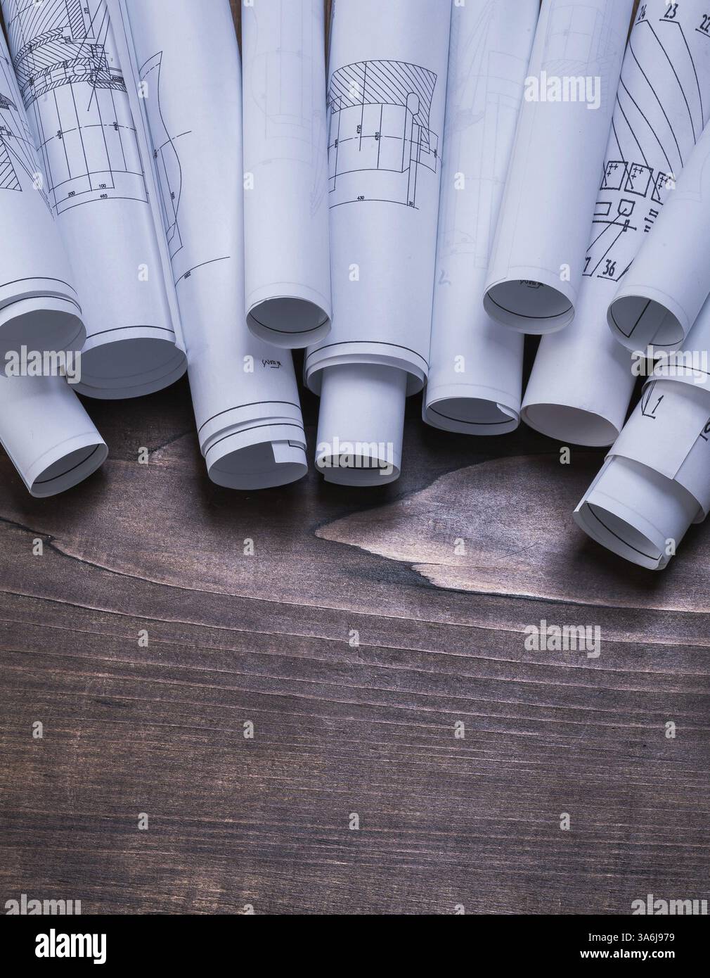 Set of blueprint rolls on pine wooden vintage board construction ...