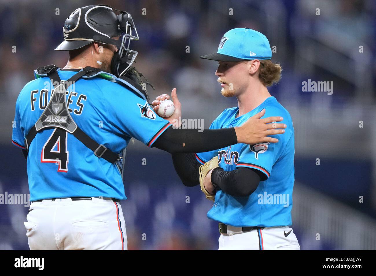Miami Marlins catcher Nick Fortes (4) talks with pitcher Max Meyer ...