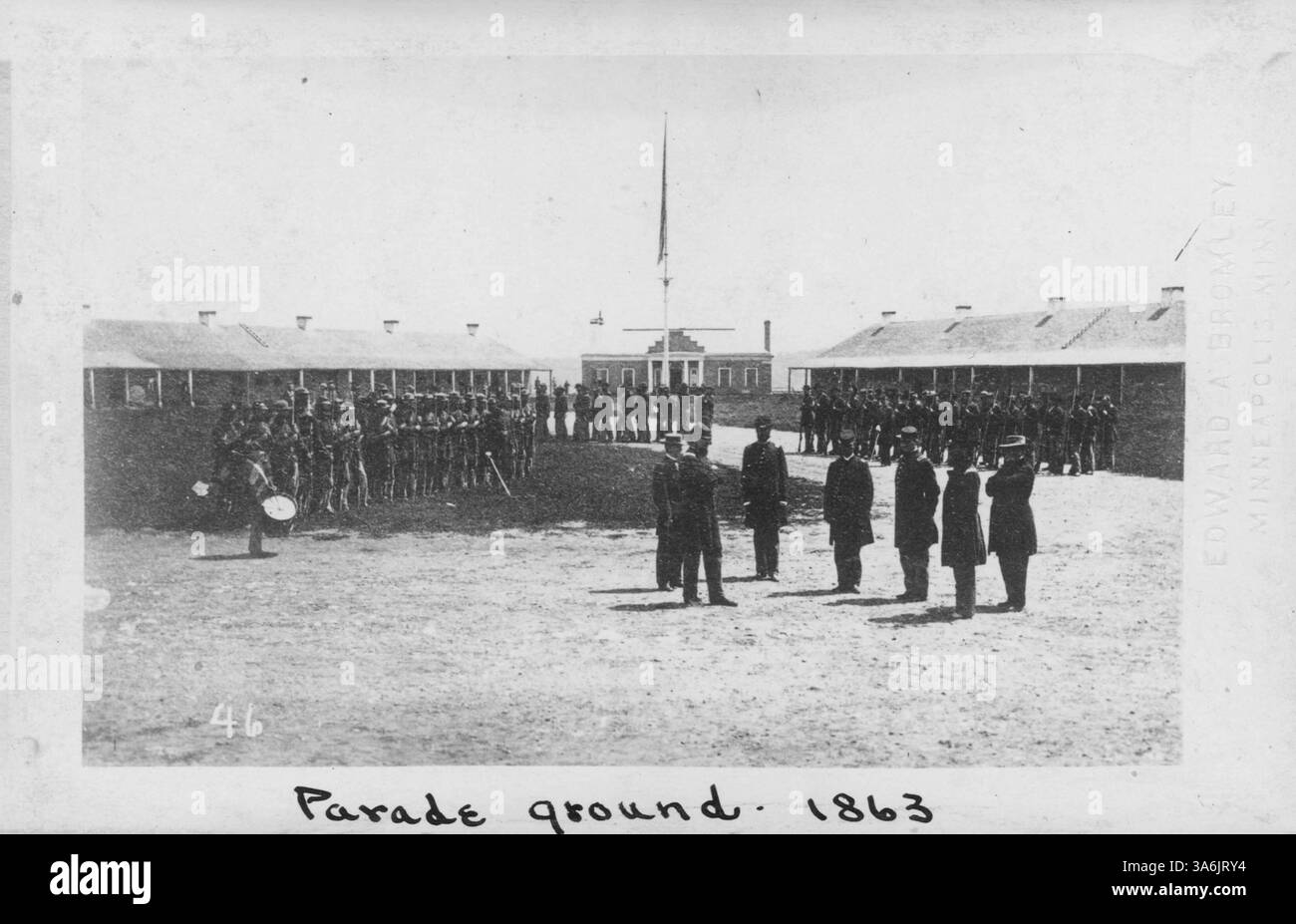 A historical image shows soldiers on the parade ground at Fort Snelling ...