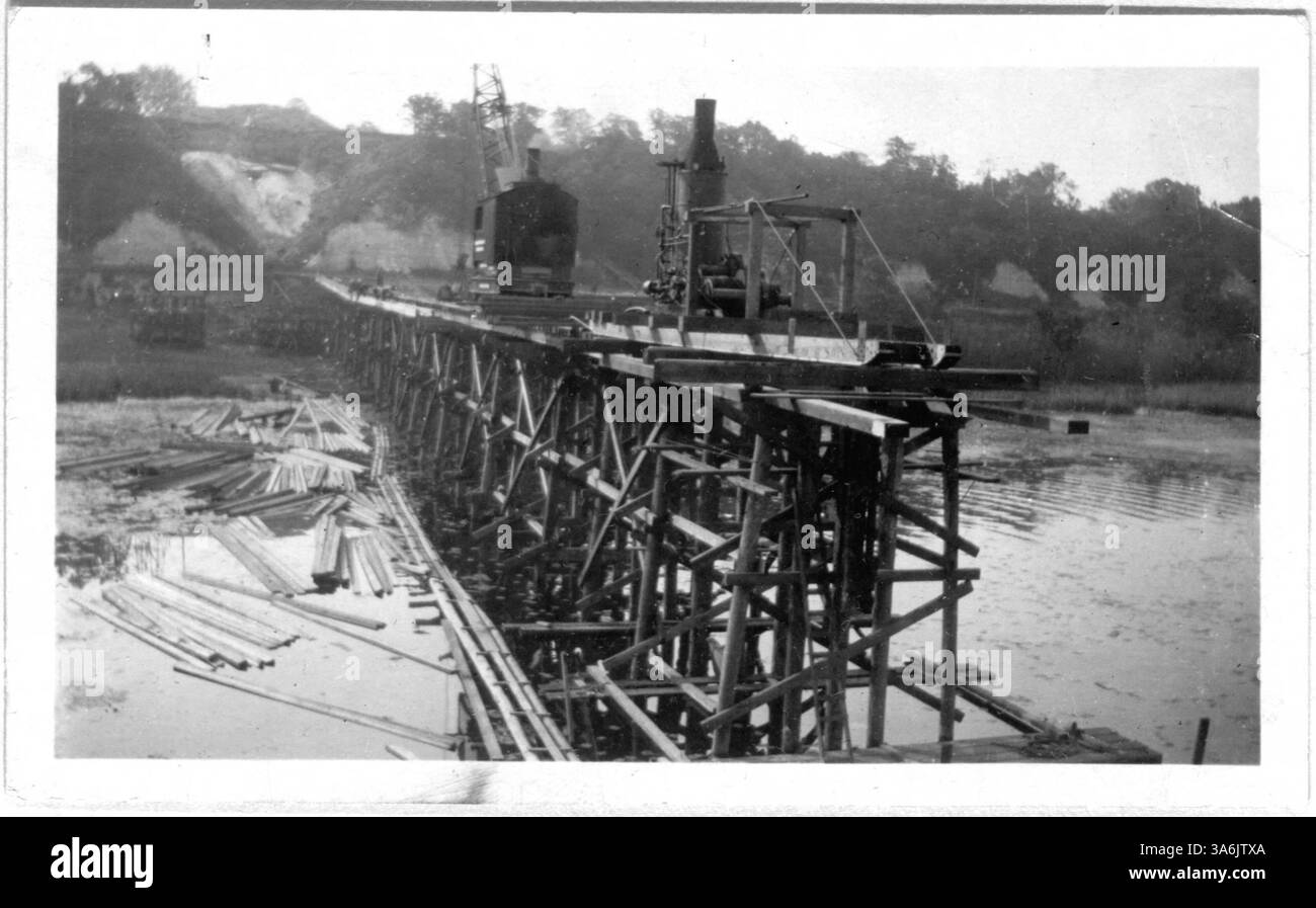 The photo shows construction equipment working on the rail tracks for ...