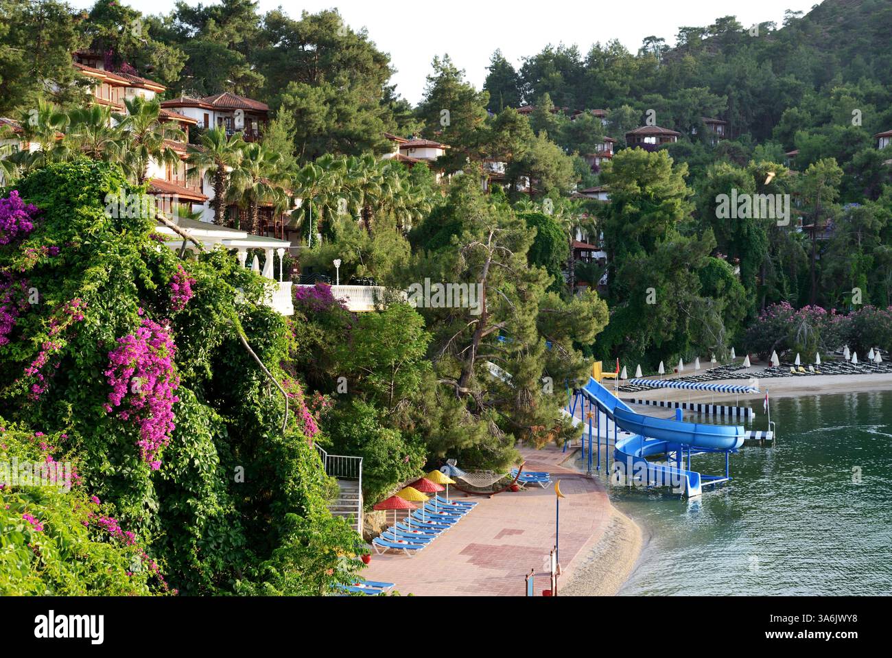 Beach on Mediterranean Turkish resort with water park slides, Fethiye ...