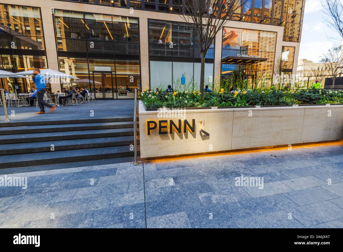 Modern entrance to Penn Station in New York with Penn 1 sign, steps ...