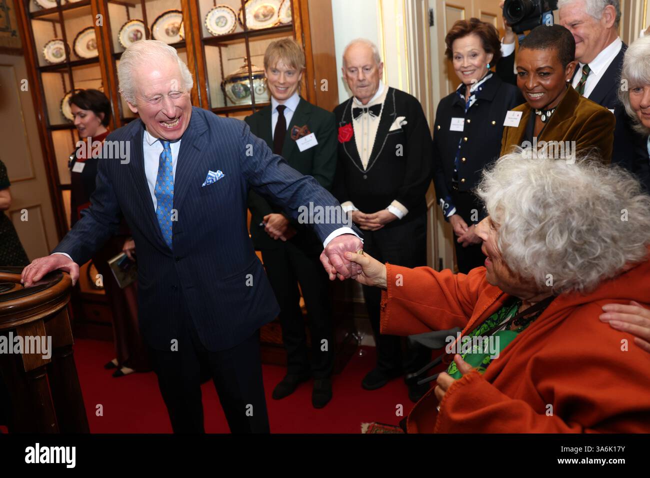 King Charles III greets Miriam Margolyes during a reception at Clarence House, London, for ...