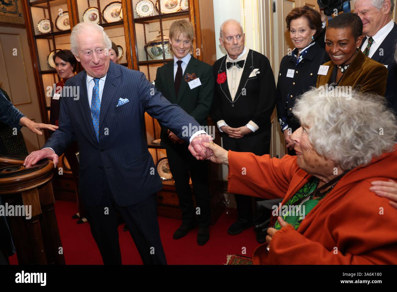 King Charles III greets Miriam Margolyes during a reception at Clarence House, London, for ...
