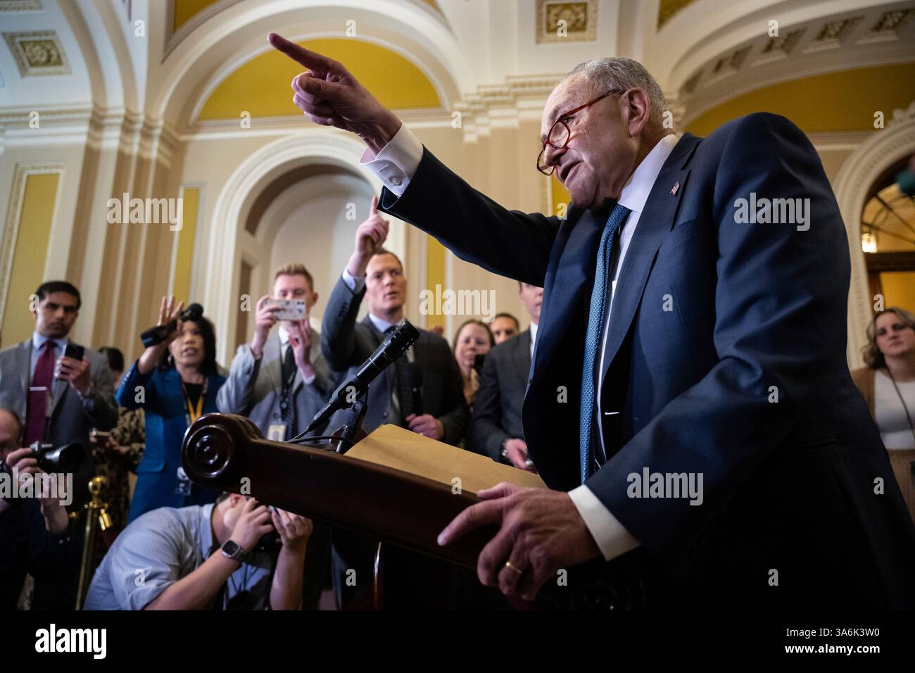 Senate Minority Leader Chuck Schumer (D-N.Y.) calls on a reporter ...