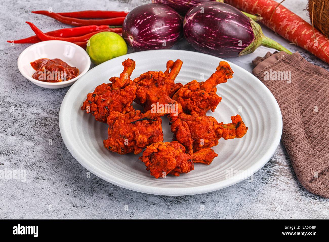 Indian cuisine - spicy red Chicken lollipop Stock Photo - Alamy